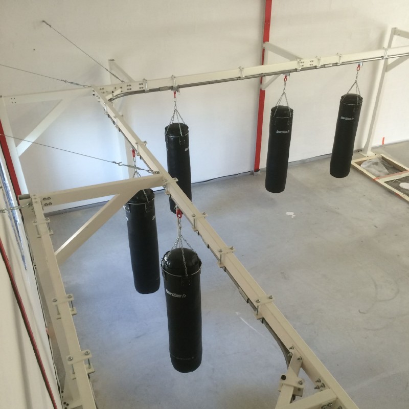 Conveyor rail with frame for punching bags | SportCom